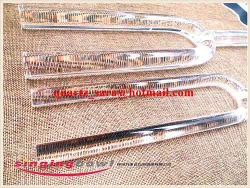 Small clear quartz crystal tuning fork