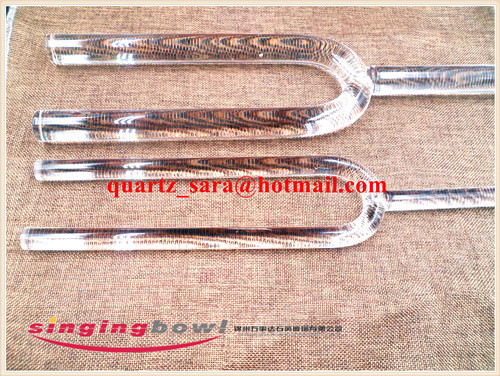 Small clear quartz crystal tuning fork